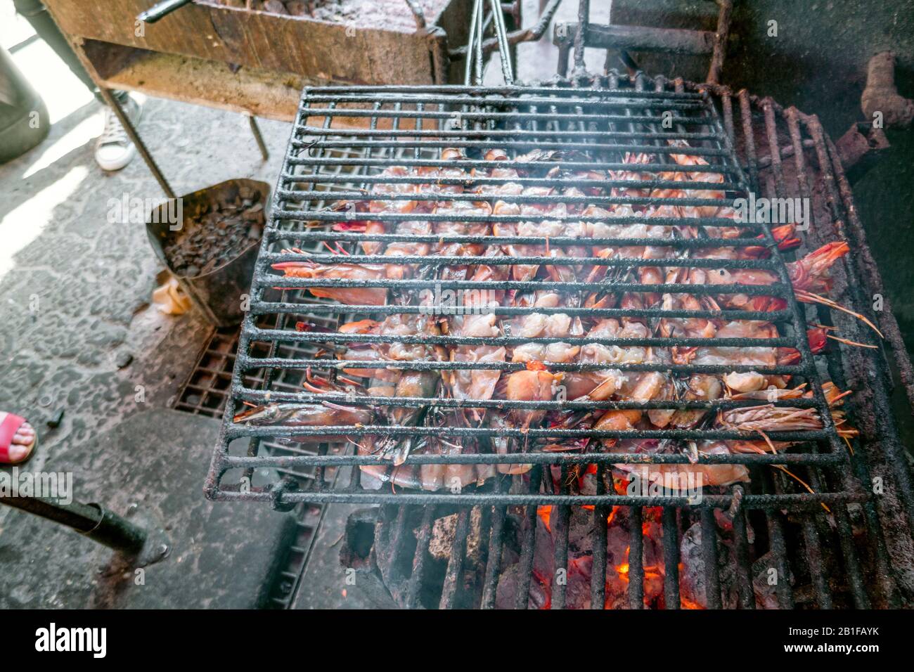 Delicious grilled lobsters still on the barbecue charcoal fire ...