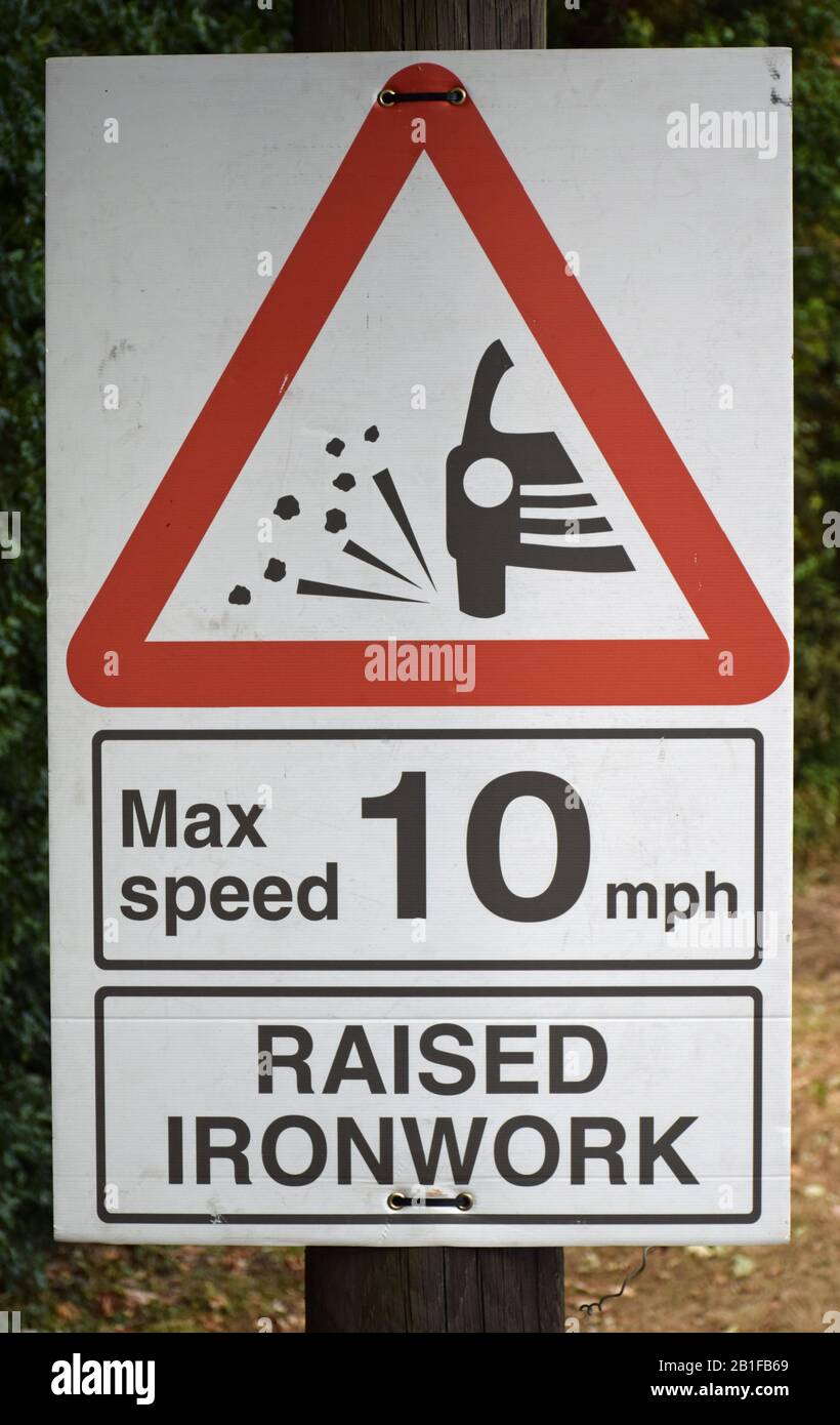 Loose Chippings, Max speed & Raised Ironwork Sign Stock Photo - Alamy