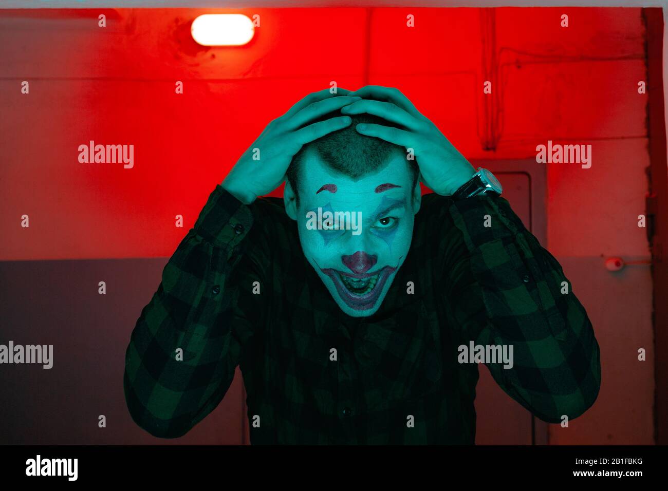 Close-up portrait of a joker man. Stock photo makeup joker in a horror ...