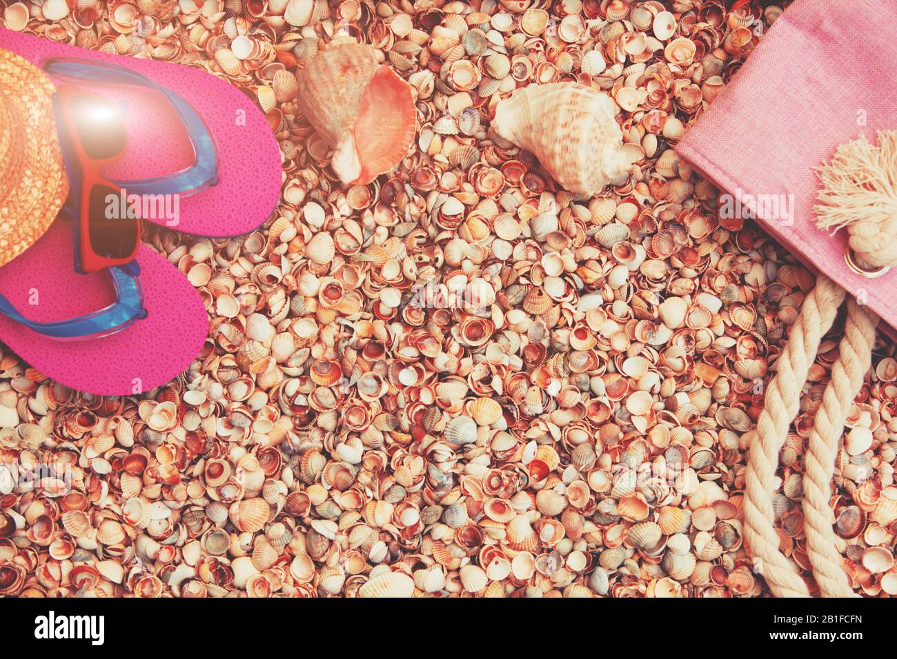 Beach scene. Women's accessories. Sunglasses, flip flops sandals and a ...