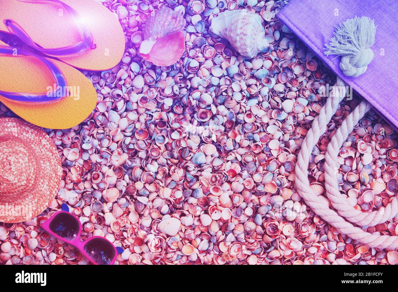 Beach scene. Women's accessories. Sunglasses, sun hat, flip flops ...