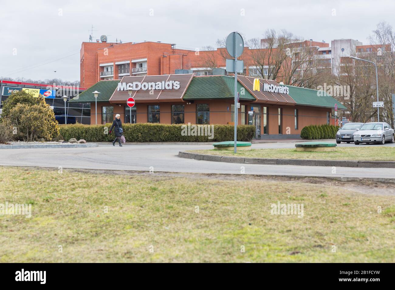 City Riga, Latvia. McDonald's fast food store and front. A person is ...
