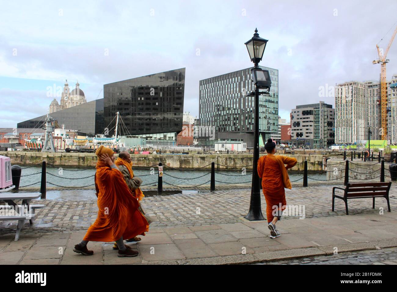 buddhist monks at albert dock liverpool england UK Stock Photo - Alamy