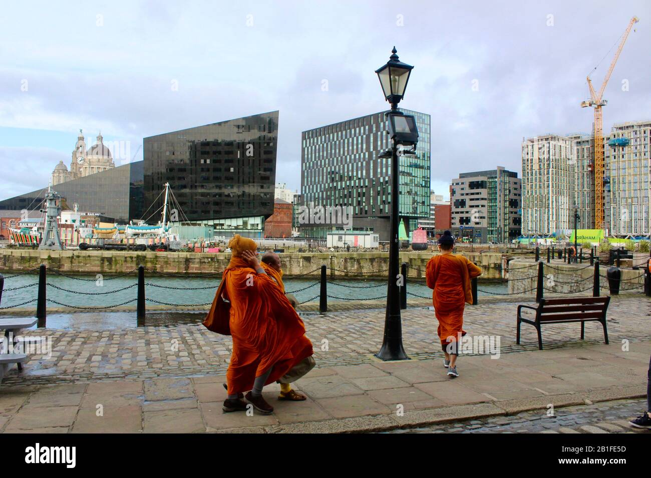 buddhist monks at albert dock liverpool england UK Stock Photo - Alamy