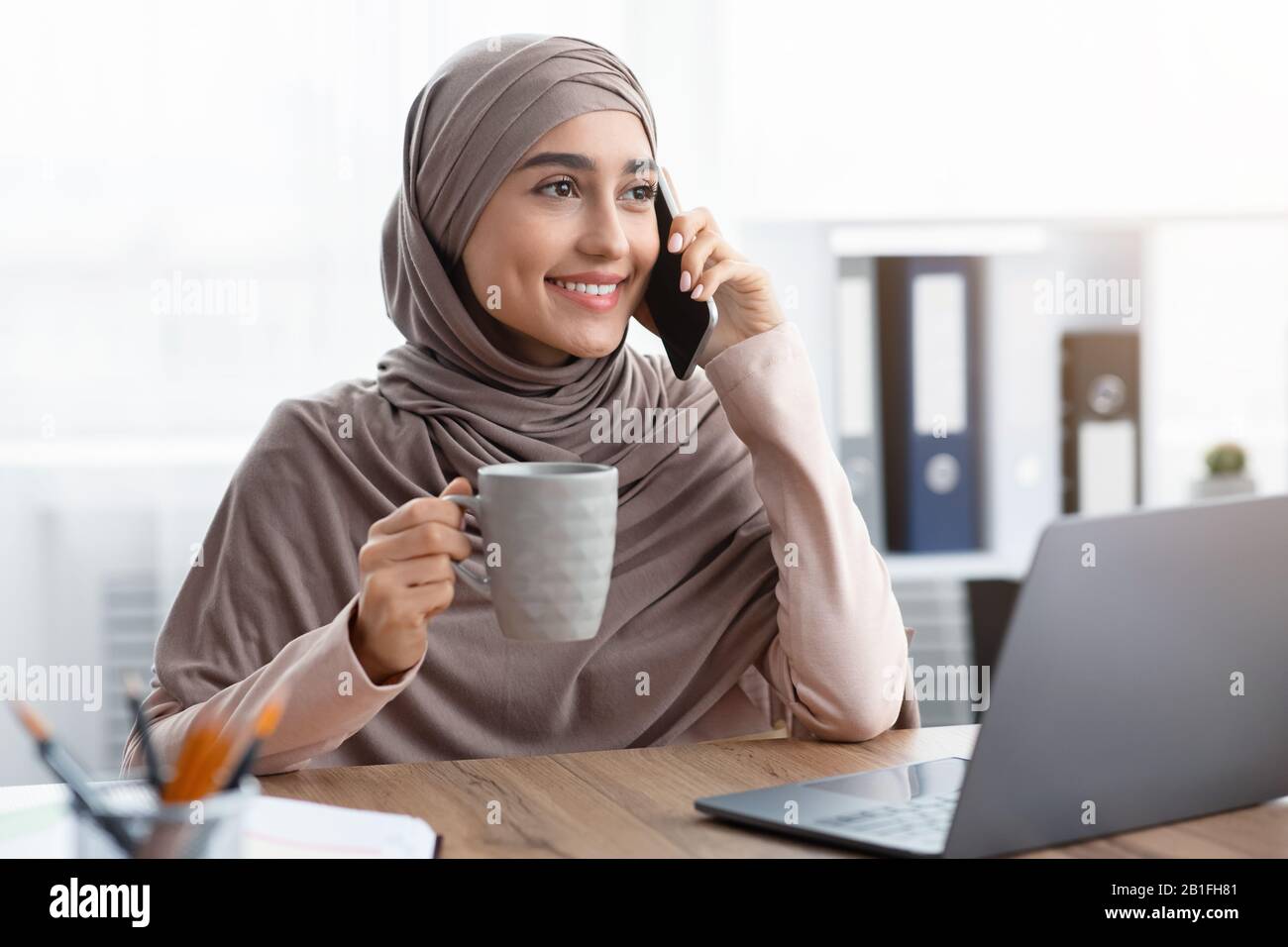 Female muslim worker hi-res stock photography and images - Alamy