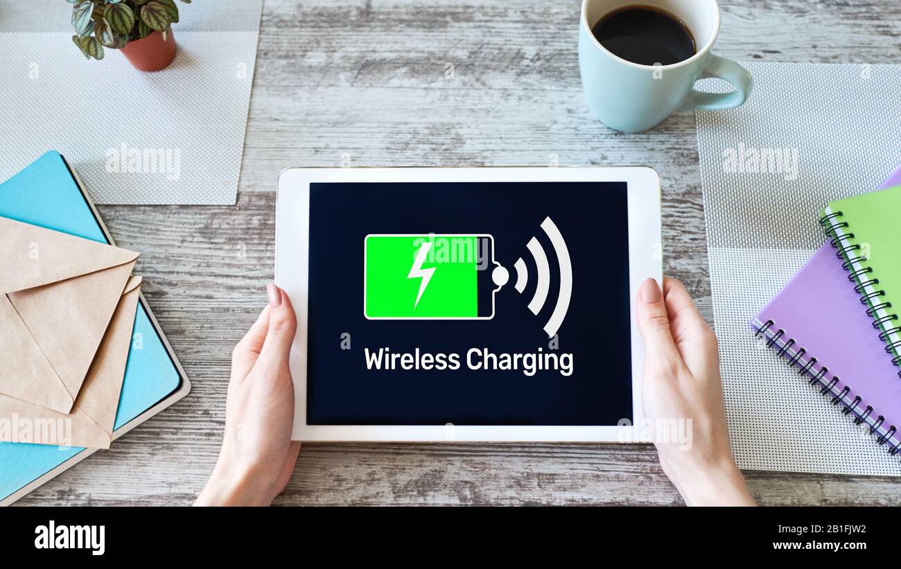 Wireless charging icons and progress bar on device screen Stock Photo ...