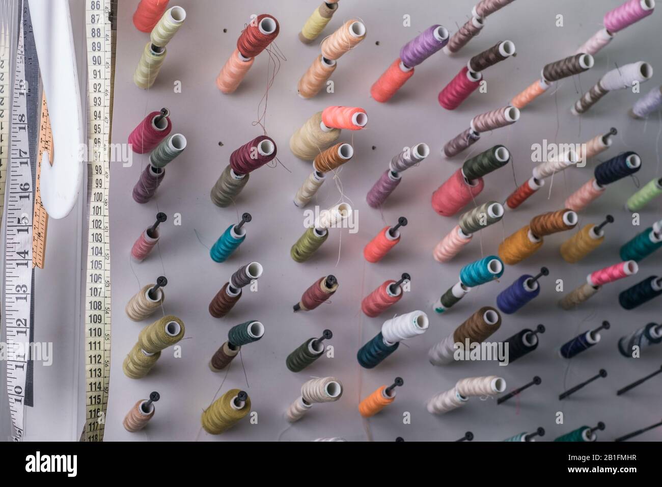 Sewing threads multicolored background closeup multi-colored sewing ...