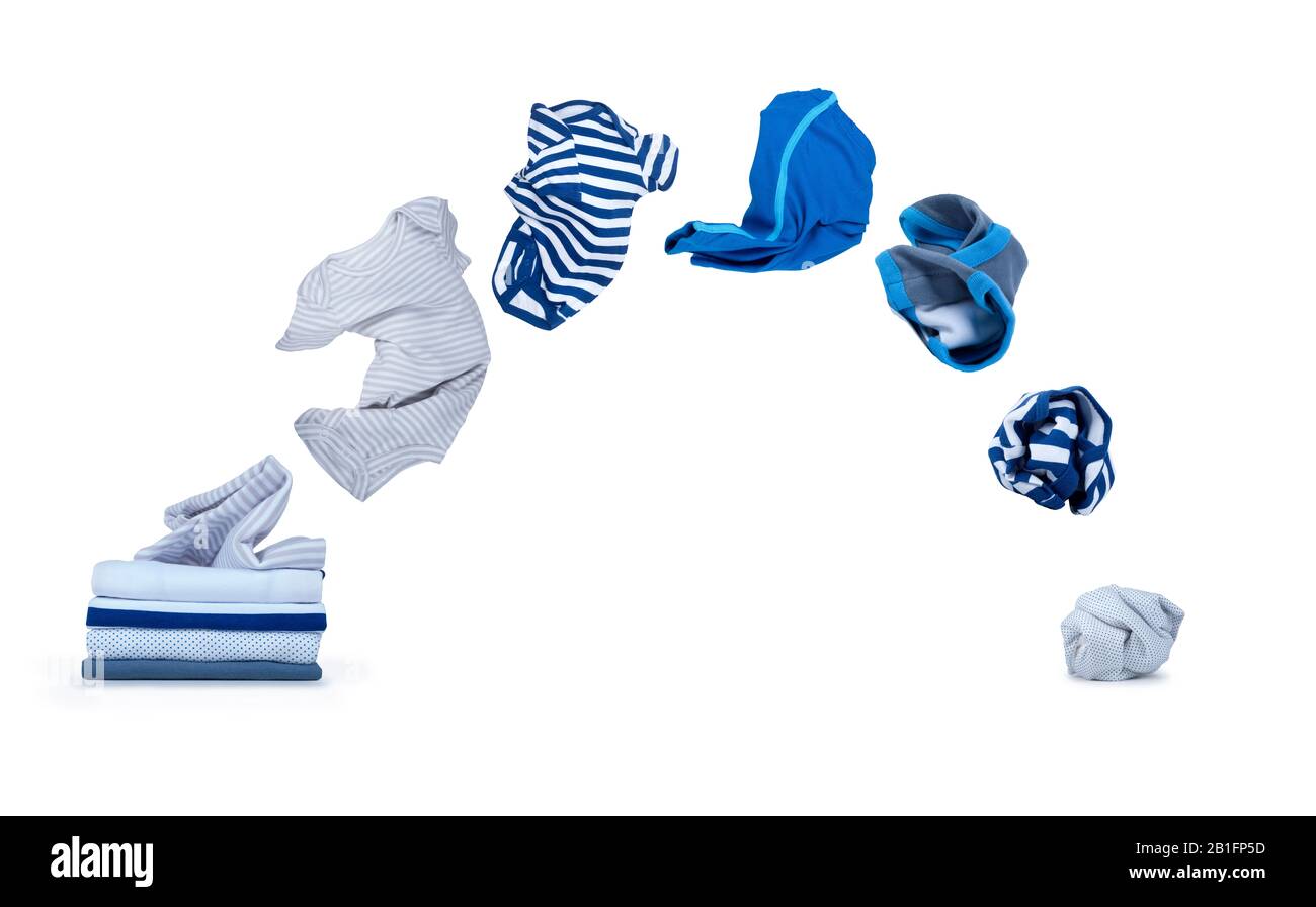 clothes fly out of pile and falls down isolated on white background ...