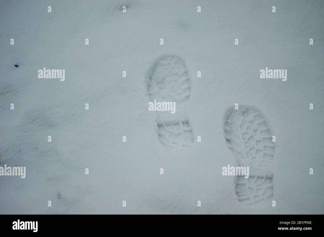 Footsteps in Snow Stock Photo - Alamy