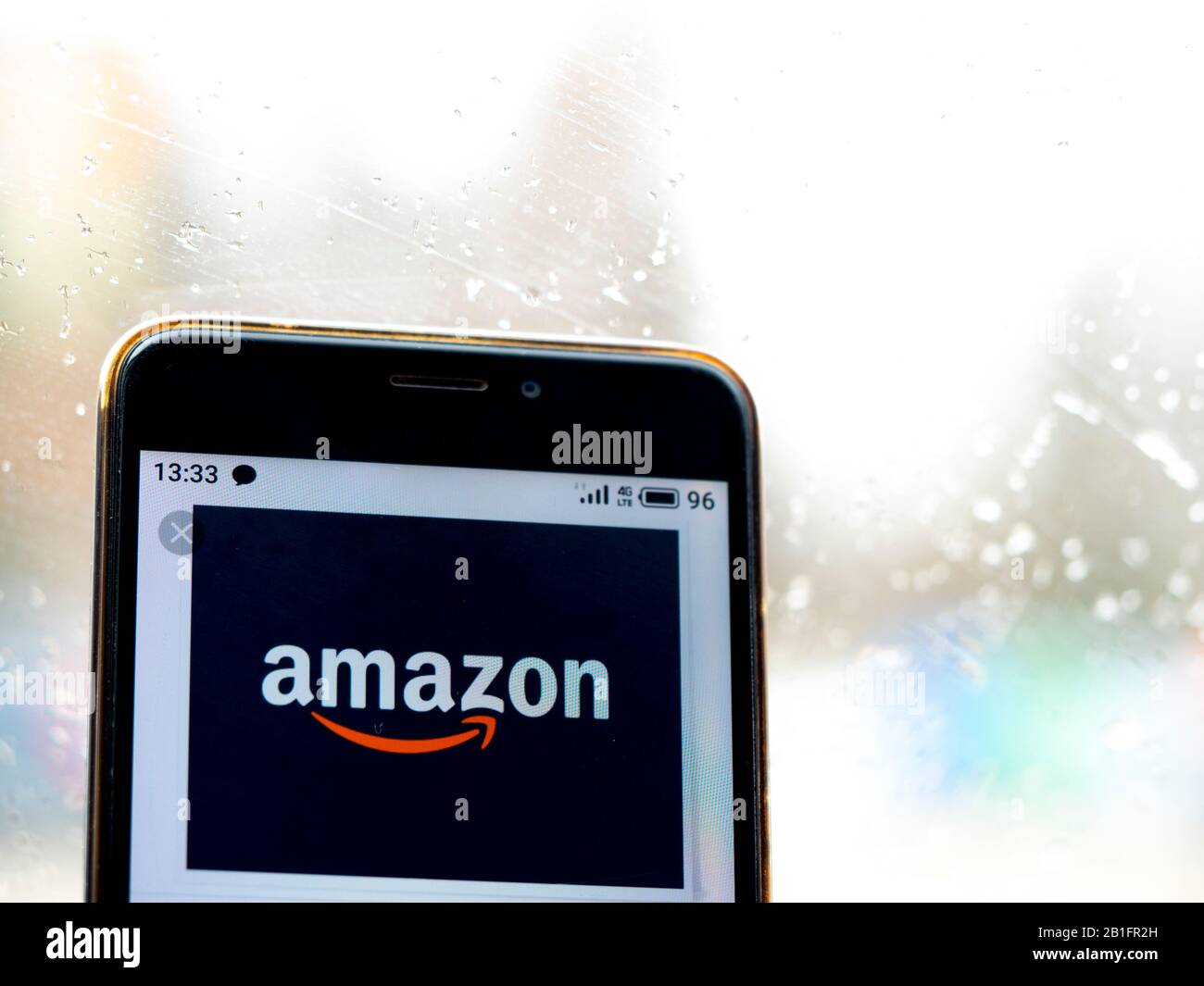 In this photo illustration the Amazon logo is seen displayed on a ...
