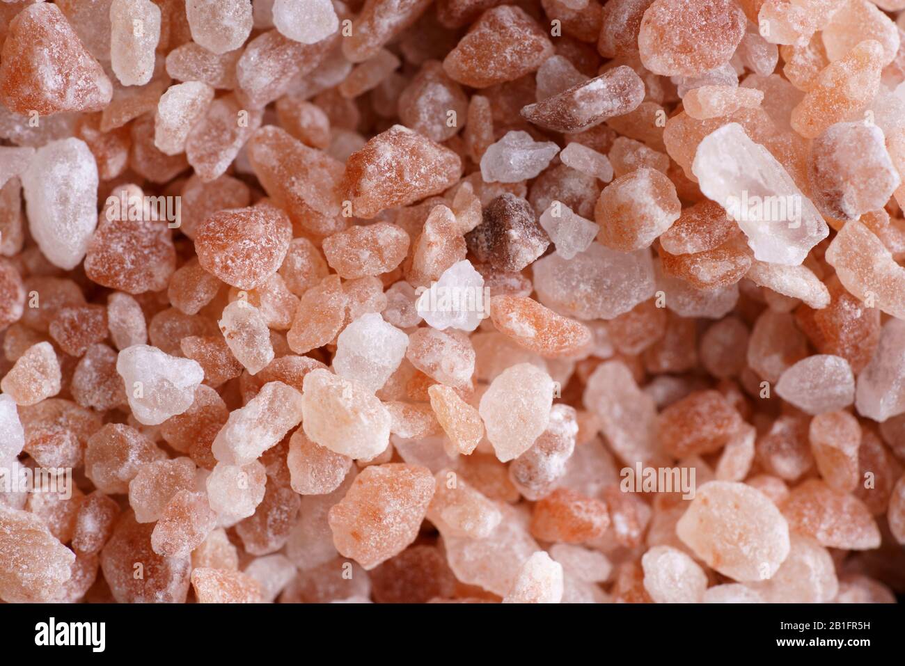 Macro shot of pink Himalayan salt. Black background, high resolution ...