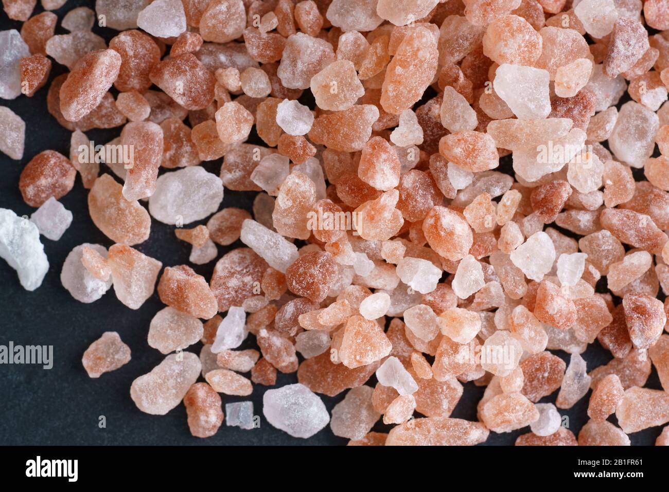 Pink Himalayan salt on slate plate. Black background, high resolution ...