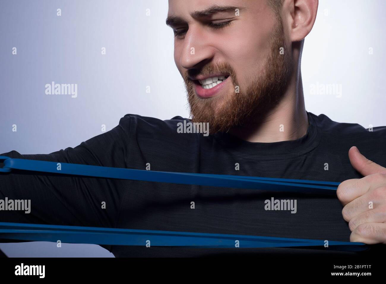 closeup portrait of a young handsome bearded athlete guy, with an ...