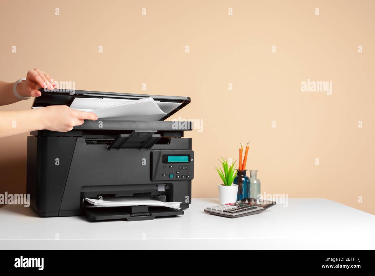 Woman using the printer to scanning and printing document. creative ...