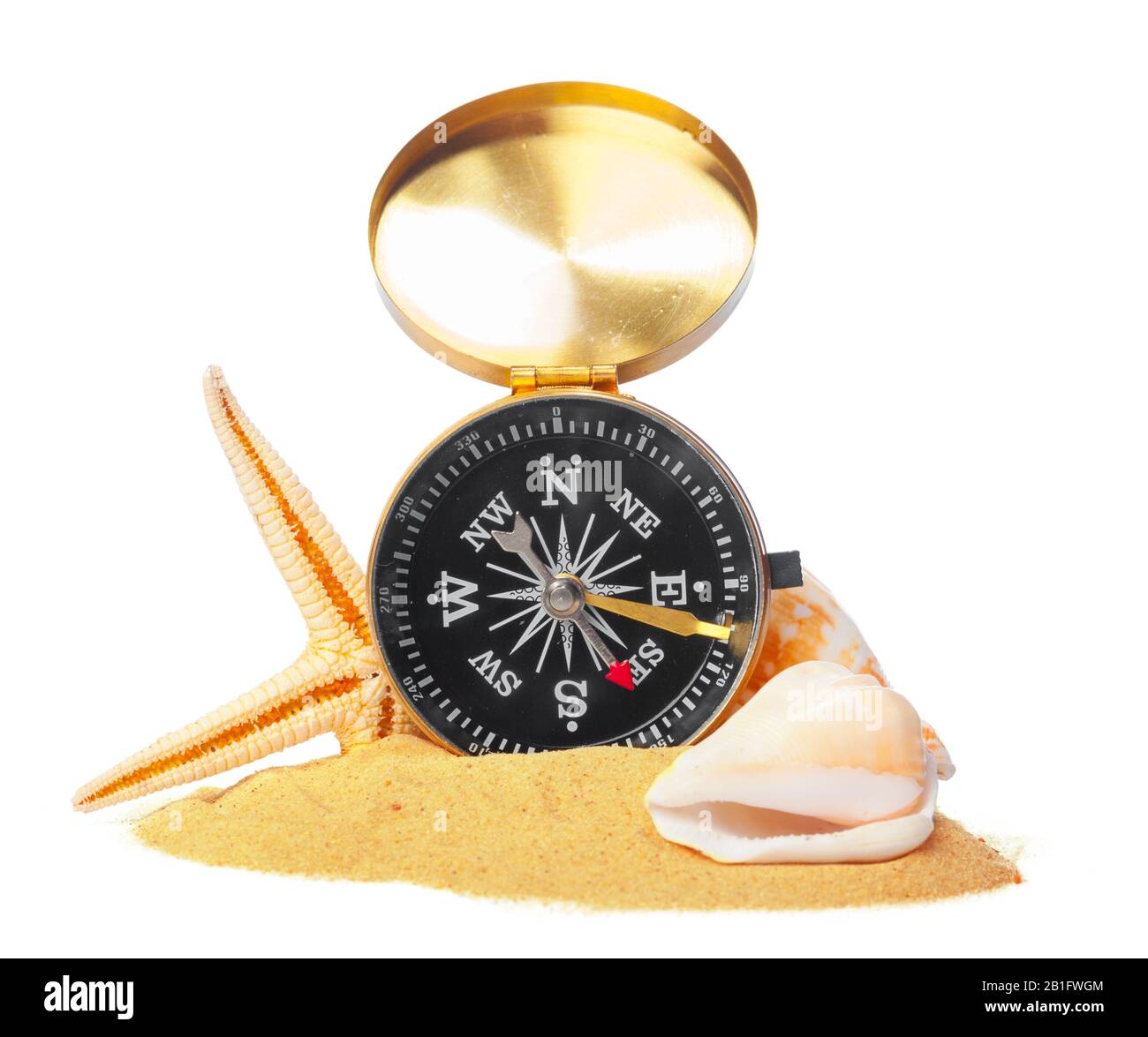 sea shells and old compass with sand isolated on white background ...
