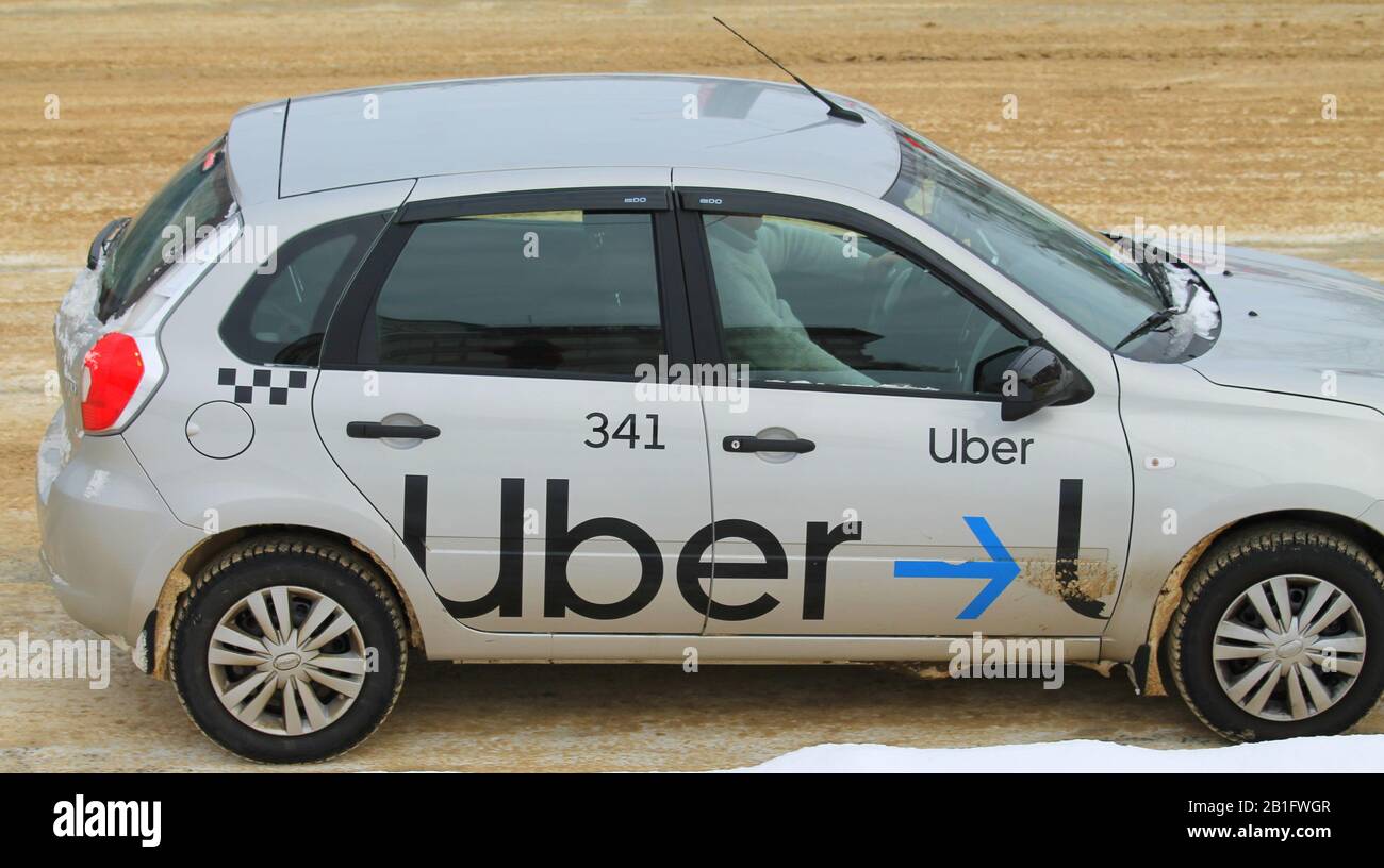 02.02.2020 Syktyvkar, Russia, Uber car on russian street background ...