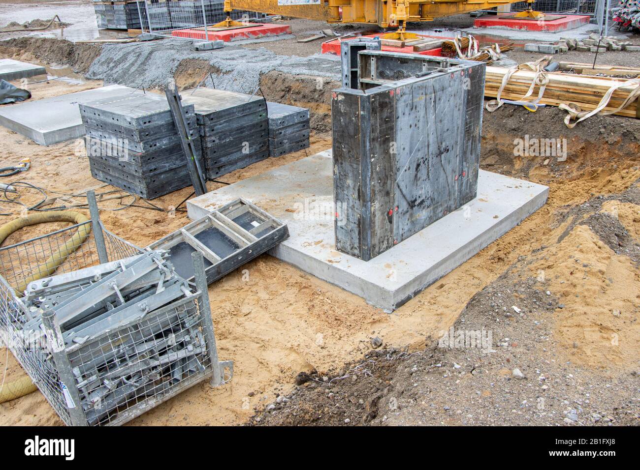 The concrete foundations for the columns of a factory building are ...