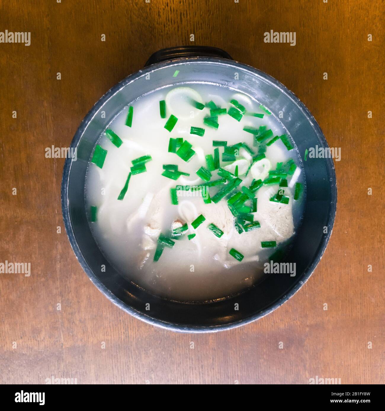 Top view of Seolleongtang (Ox Bone Soup), milky beef bone soup. It is a ...