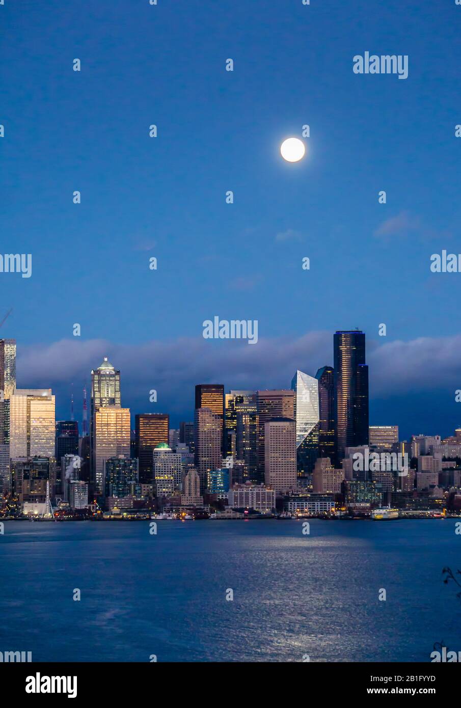 A bright full moon shines over the Seattle skyline Stock Photo - Alamy