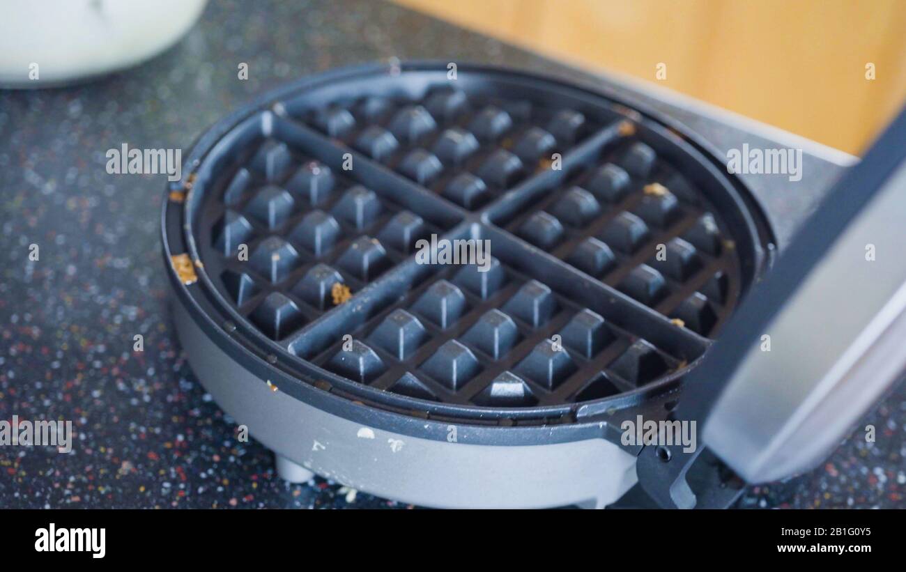 Making homemade waffles in an electric waffle maker Stock Photo - Alamy
