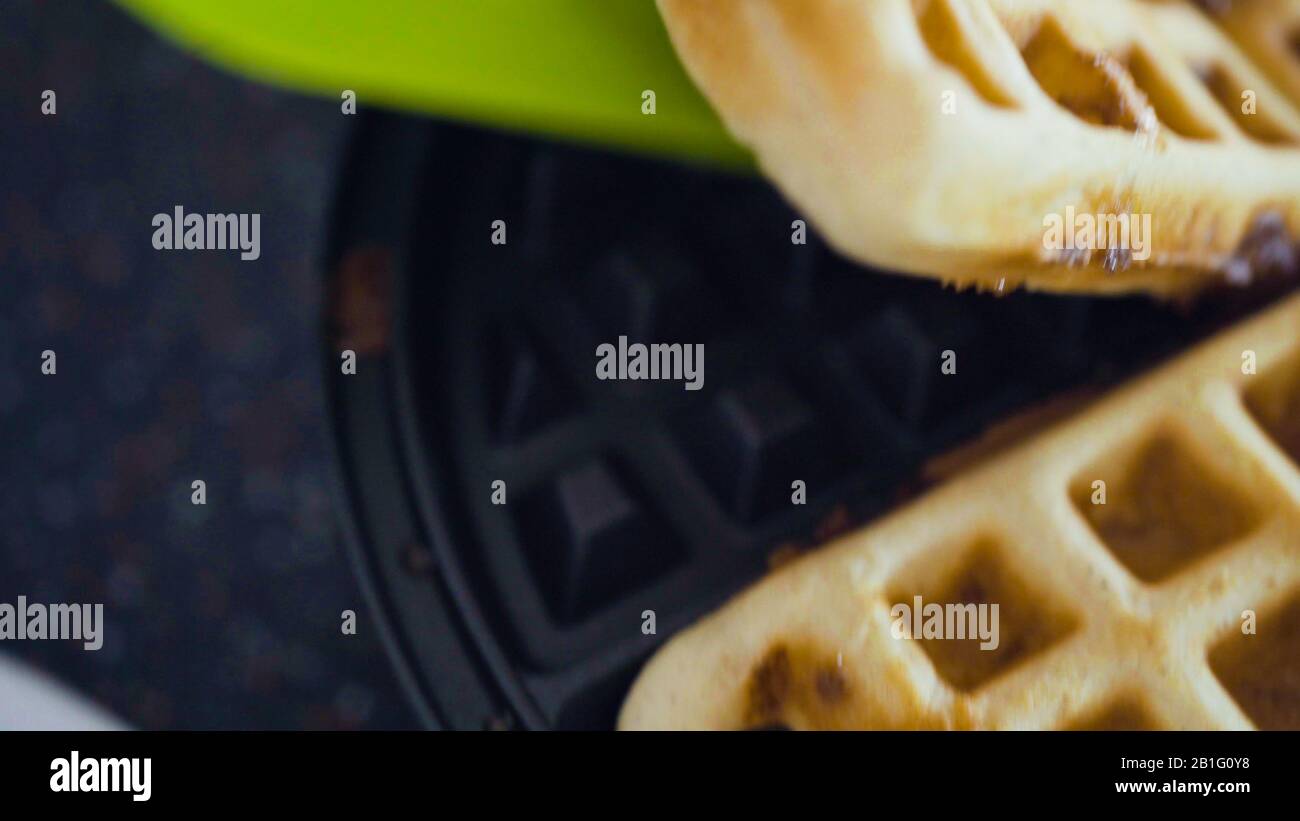 Making homemade waffles in an electric waffle maker Stock Photo - Alamy