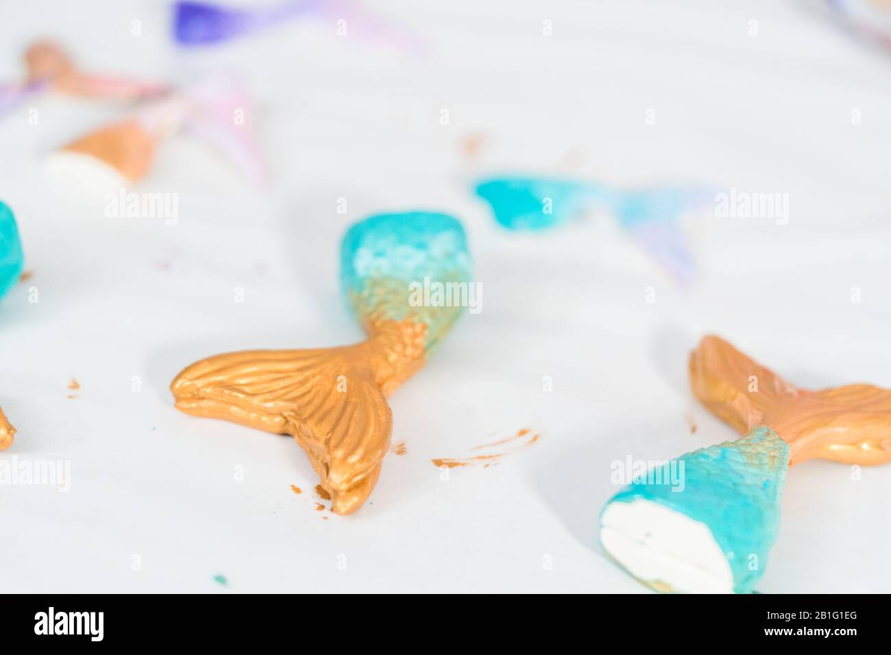 Mermaid tails made out of modeling clay and painted with acrylic paint ...