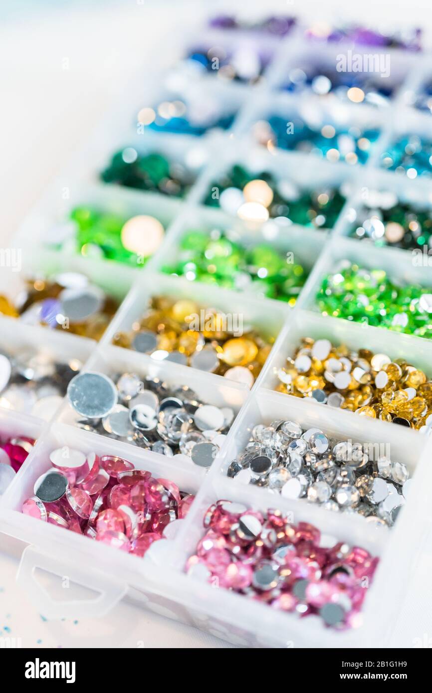 Color and size variety of rhinestones in the craft box Stock Photo - Alamy