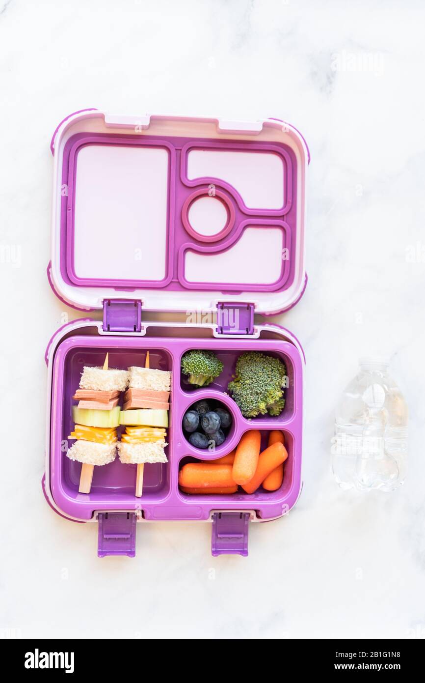 Flat lay. Healthy school lunch with kebab sandwich and vegetables in ...