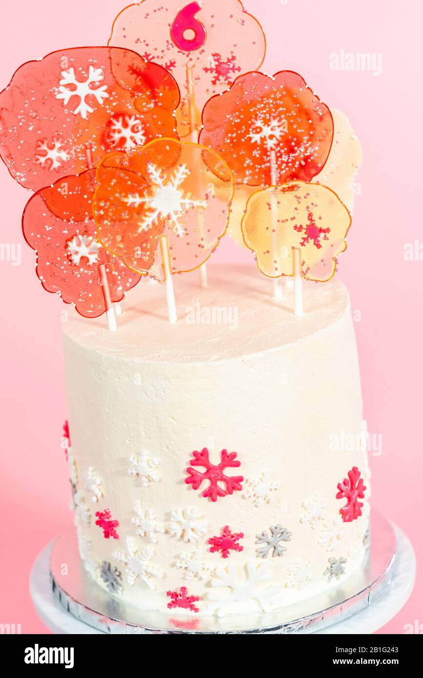 Tall round cake with Italian buttercream frosting decorated with ...