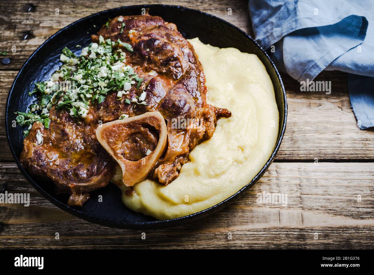 Osso Buco With Gremolata Condiment Of Chopping Cilantro Garlic And Lemon Zest Served With