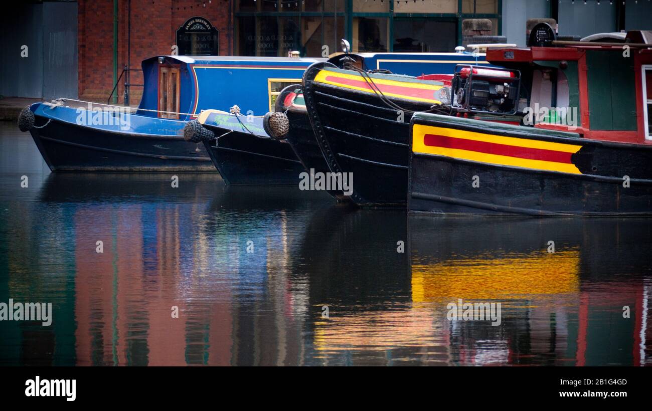 Colourful Narrowboats moored at Gas Street Basin in Birmingham, UK ...