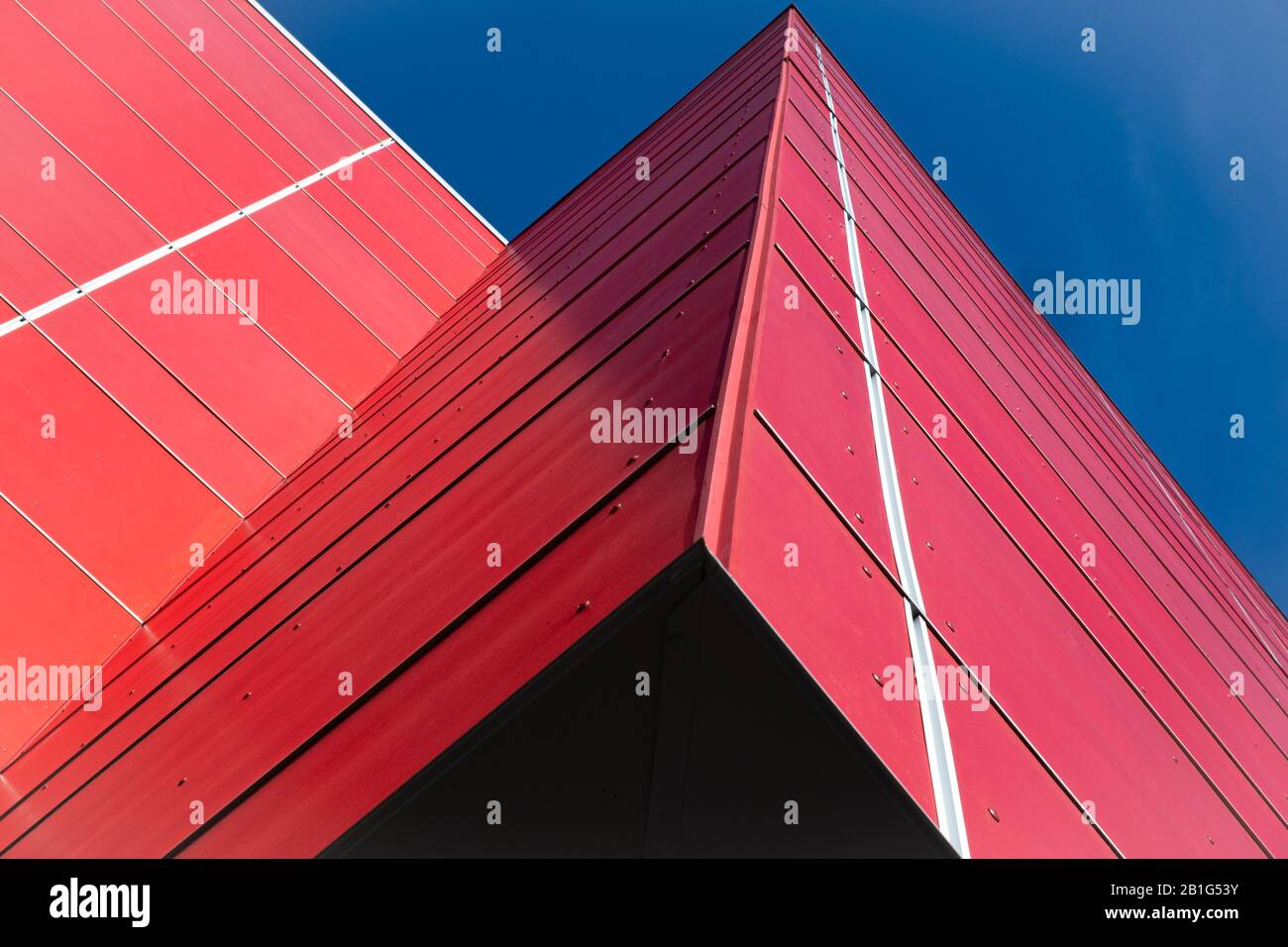 Abstract red building against blue sky Stock Photo - Alamy