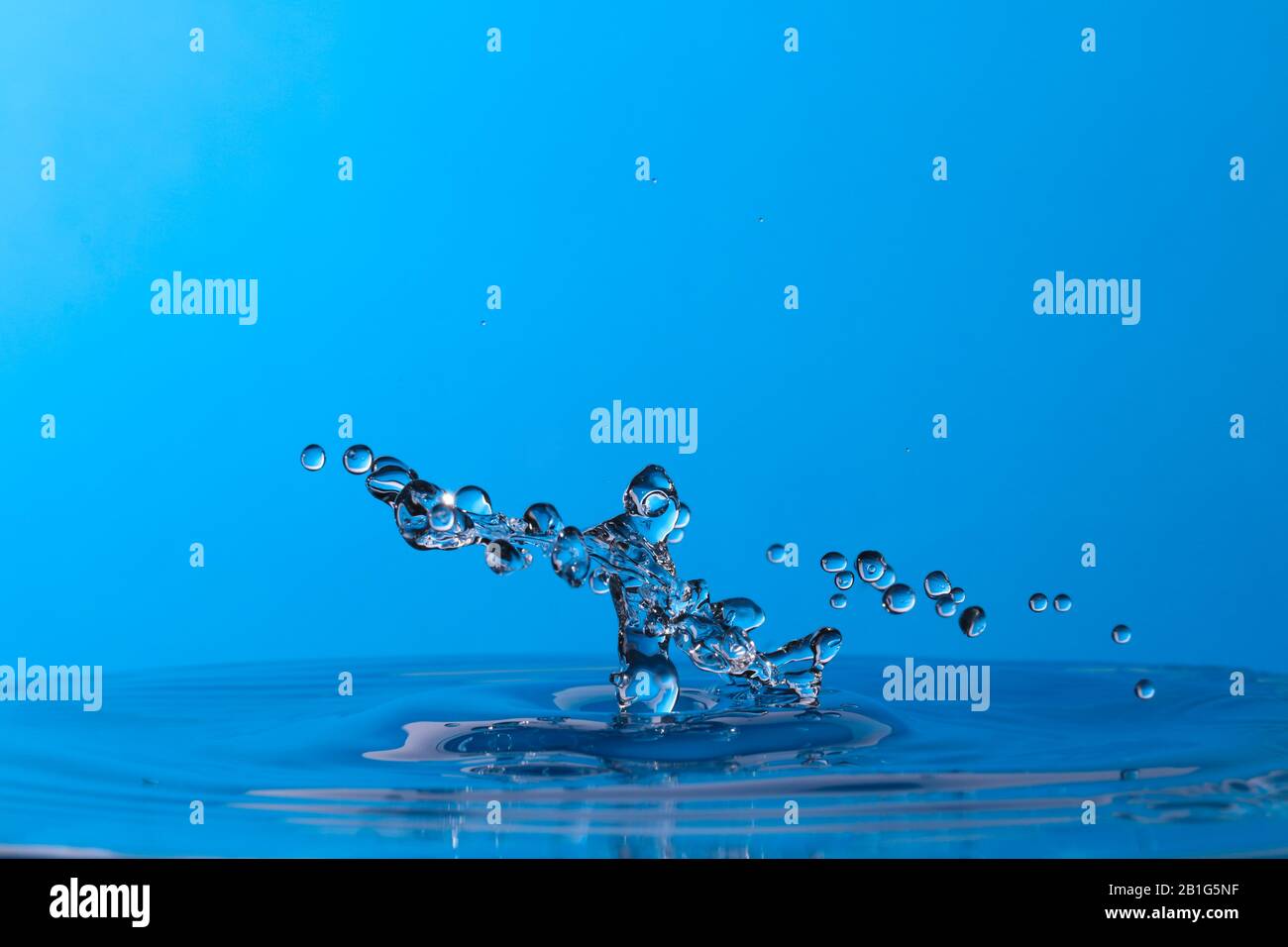 Abstract photograph of a water drop collision created with two water ...