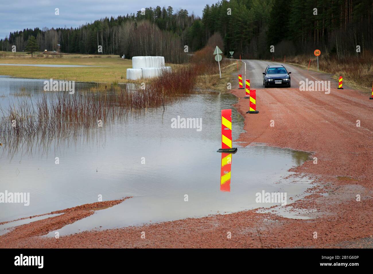 Flooded byroad 11101 off Highway 110 in South of Finland with traffic ...