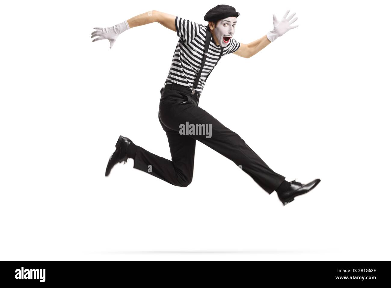 Happy mime jumping isolated on white background Stock Photo - Alamy