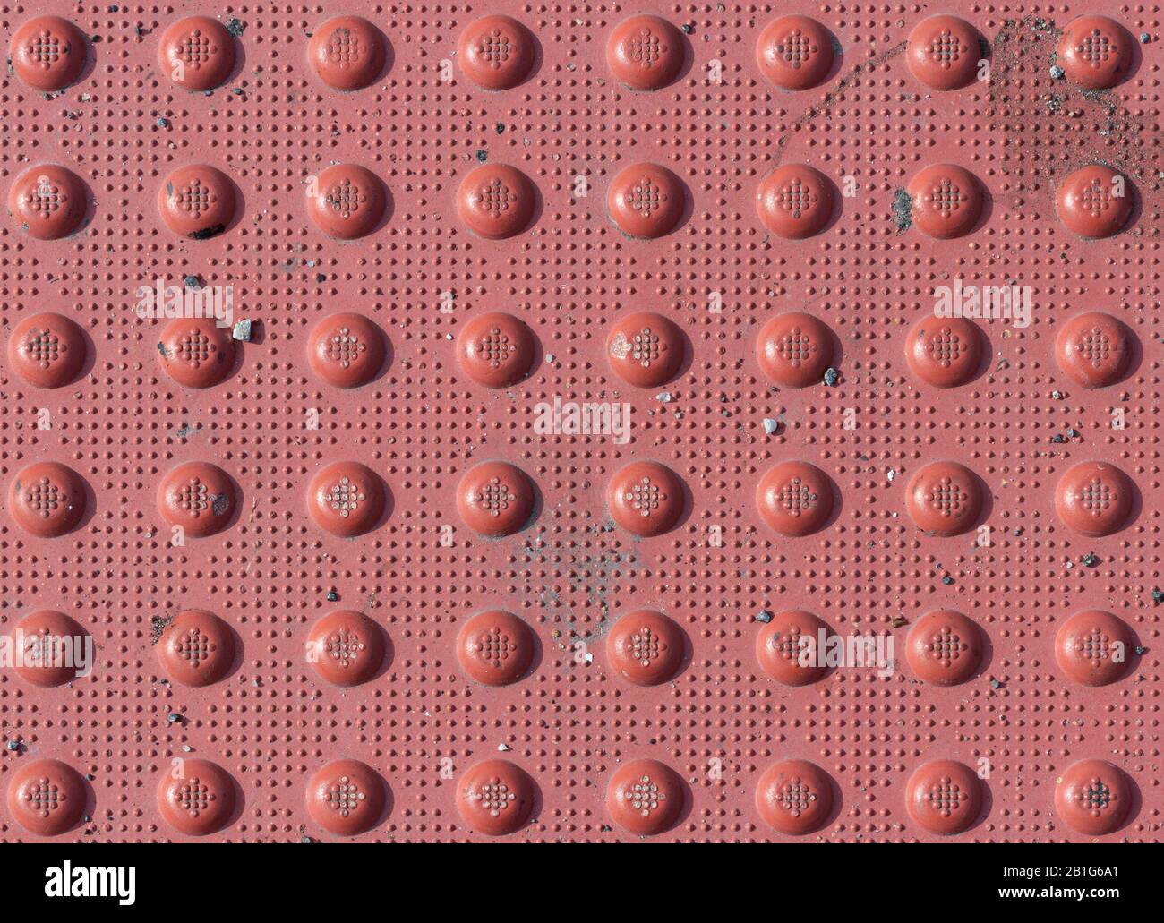 Steel Rivets On Red Plate Stock Photo - Alamy