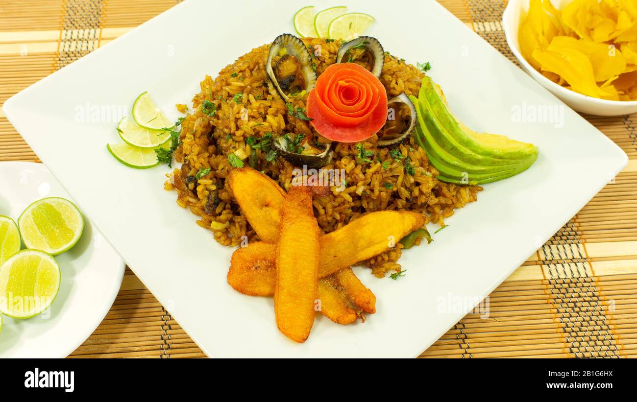 Top view of Plate of rice with shell accompanied with pieces of fried ...