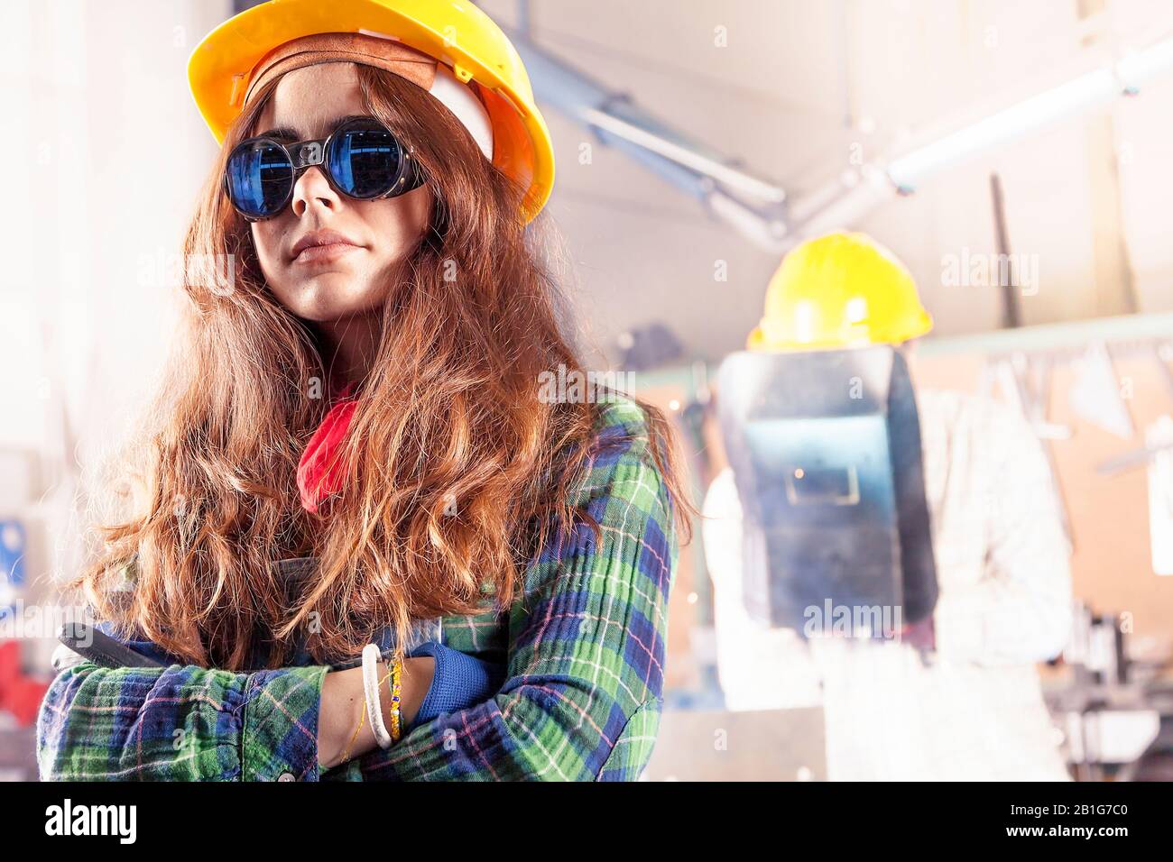 portrait of pretty female worker in a steel mill Stock Photo - Alamy