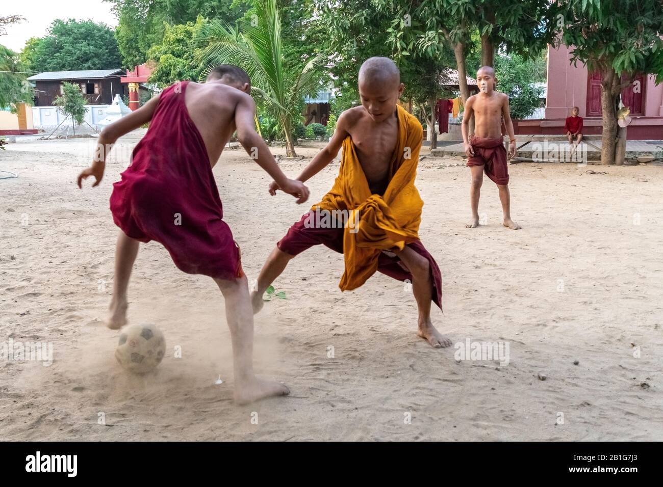 Novice monks playing football at Buddhist monastery, Mingun, Mandalay ...