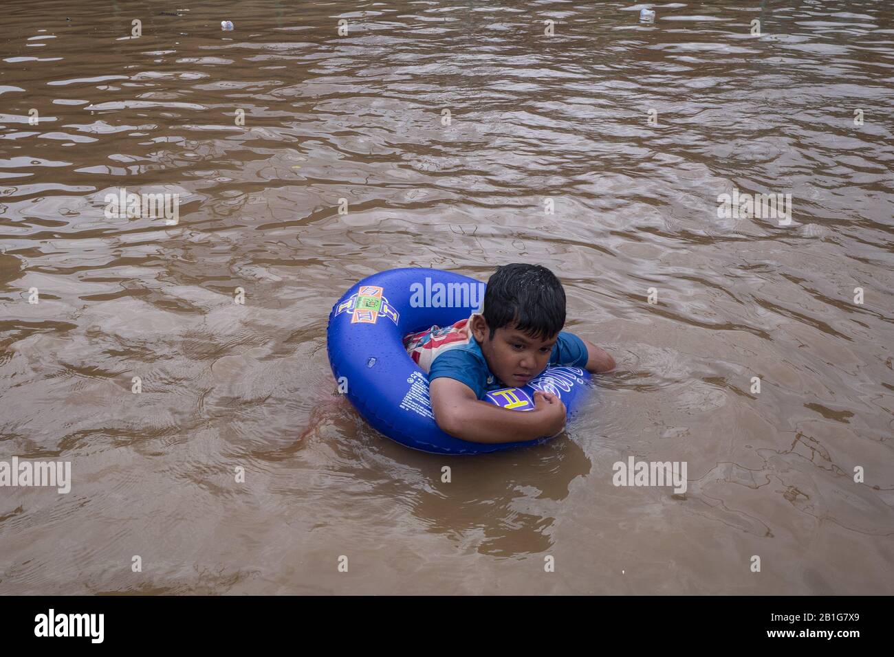Children playing in flood water hi-res stock photography and images - Alamy
