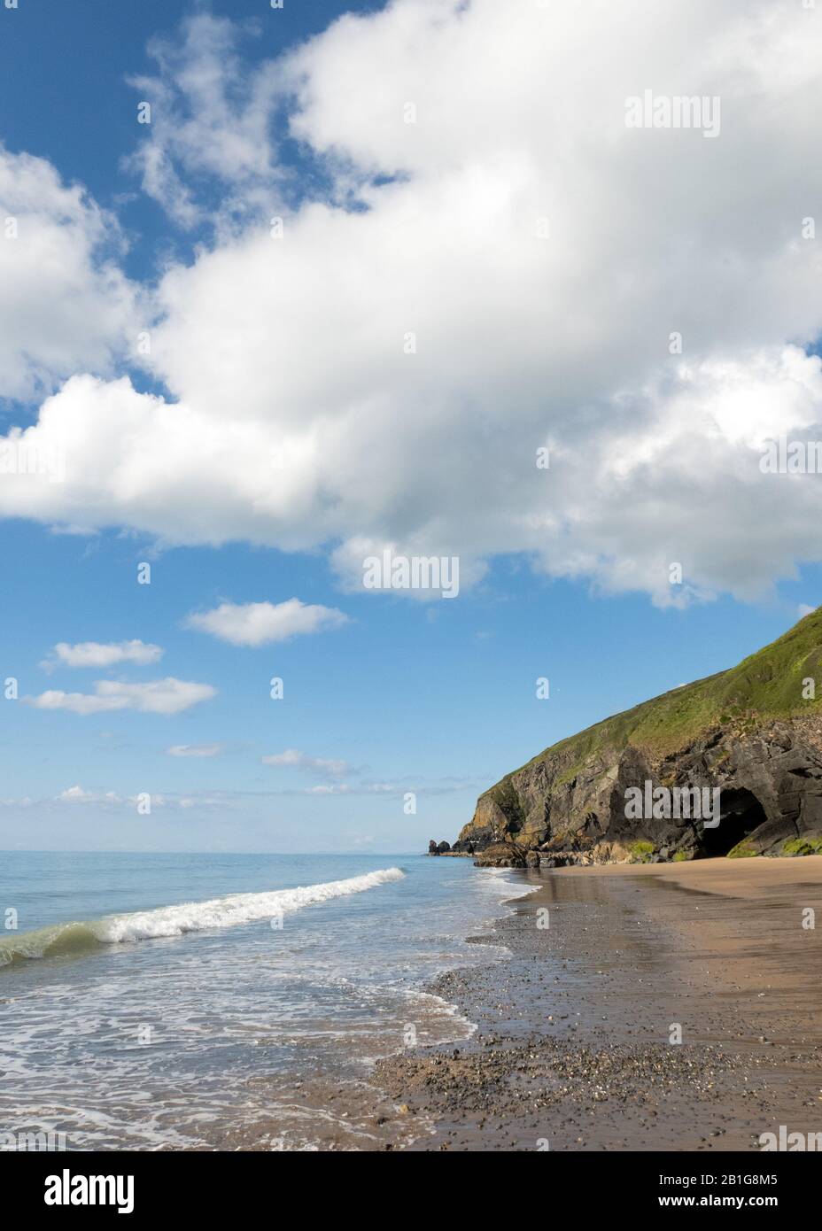 Colour photograph showing the wide expanse of the receding shallow ...