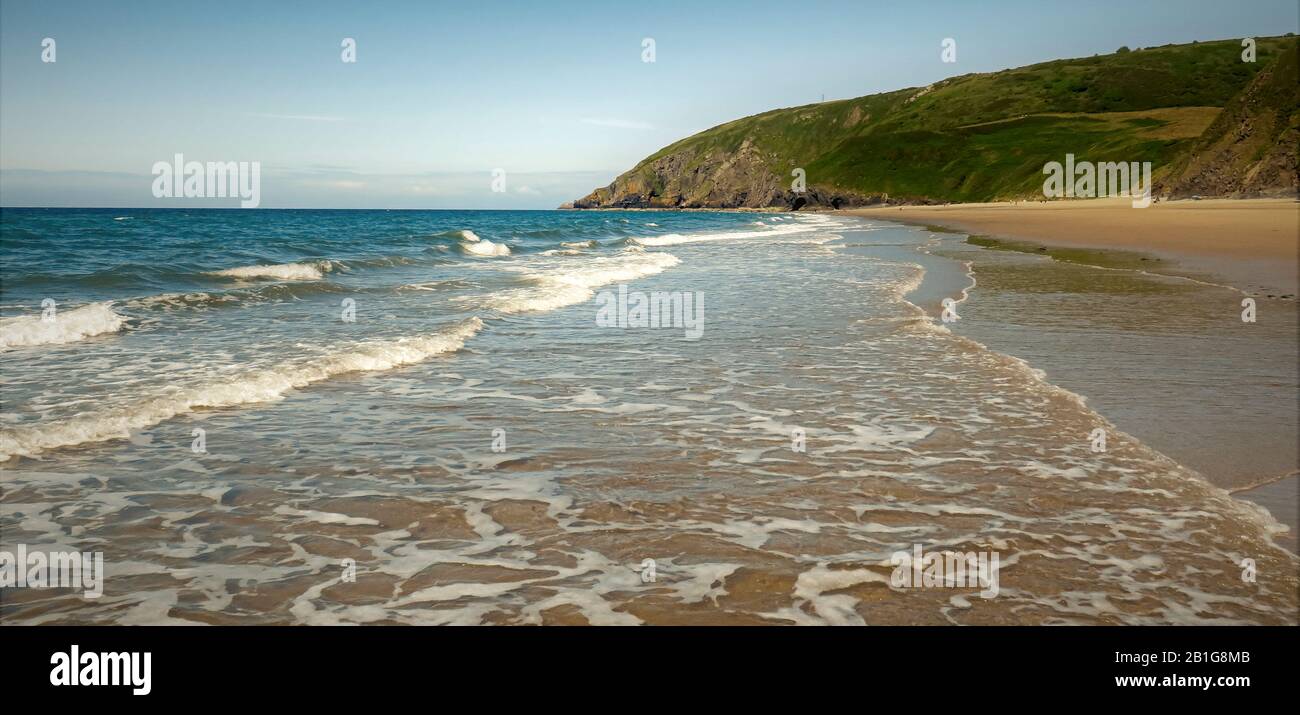 Colour photograph showing the wide expanse of the receding shallow ...
