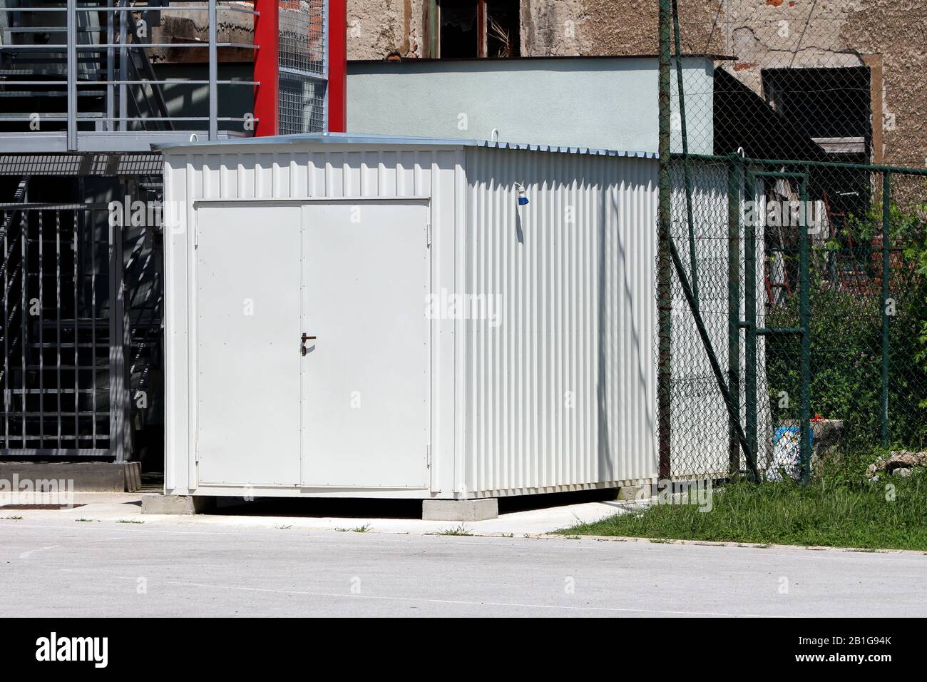 New shipping container converted into storage area with metal locked ...