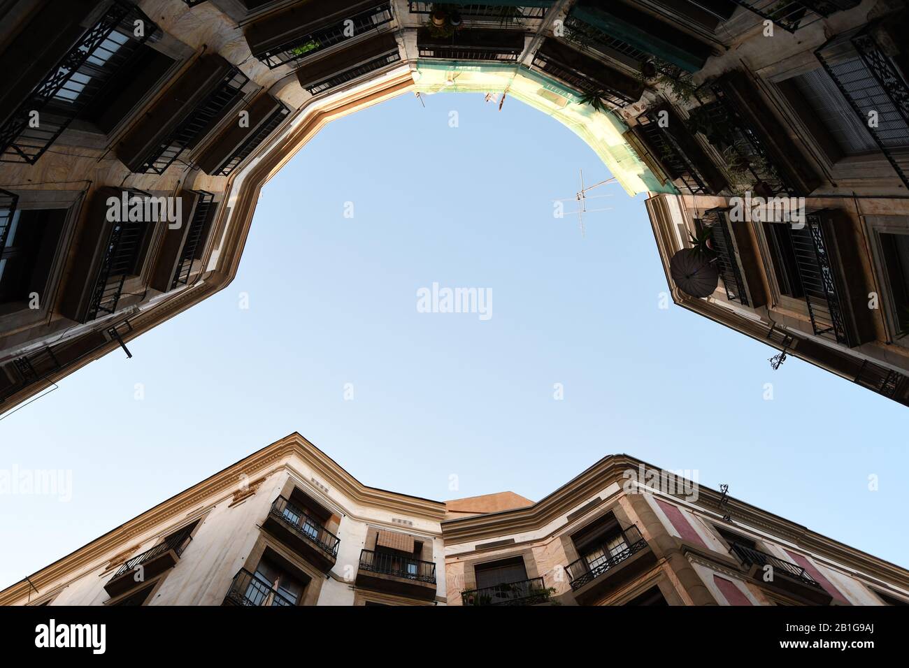Round square, buildings from below with clear sky background in ...