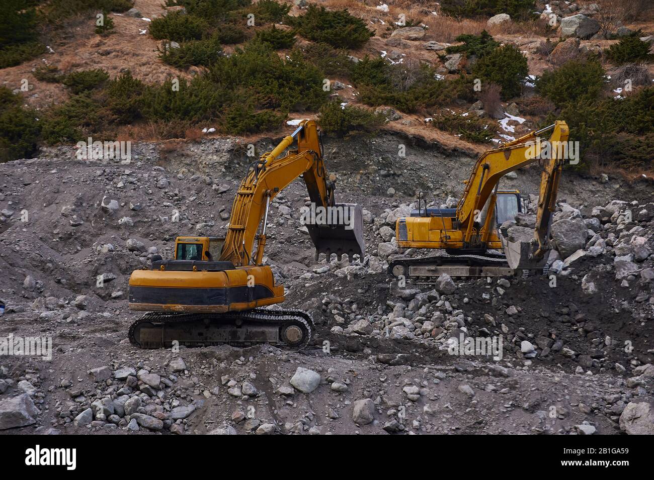 Two excavators digging ground together Stock Photo - Alamy Two excavators digging ground together Stock Photo - Alamy