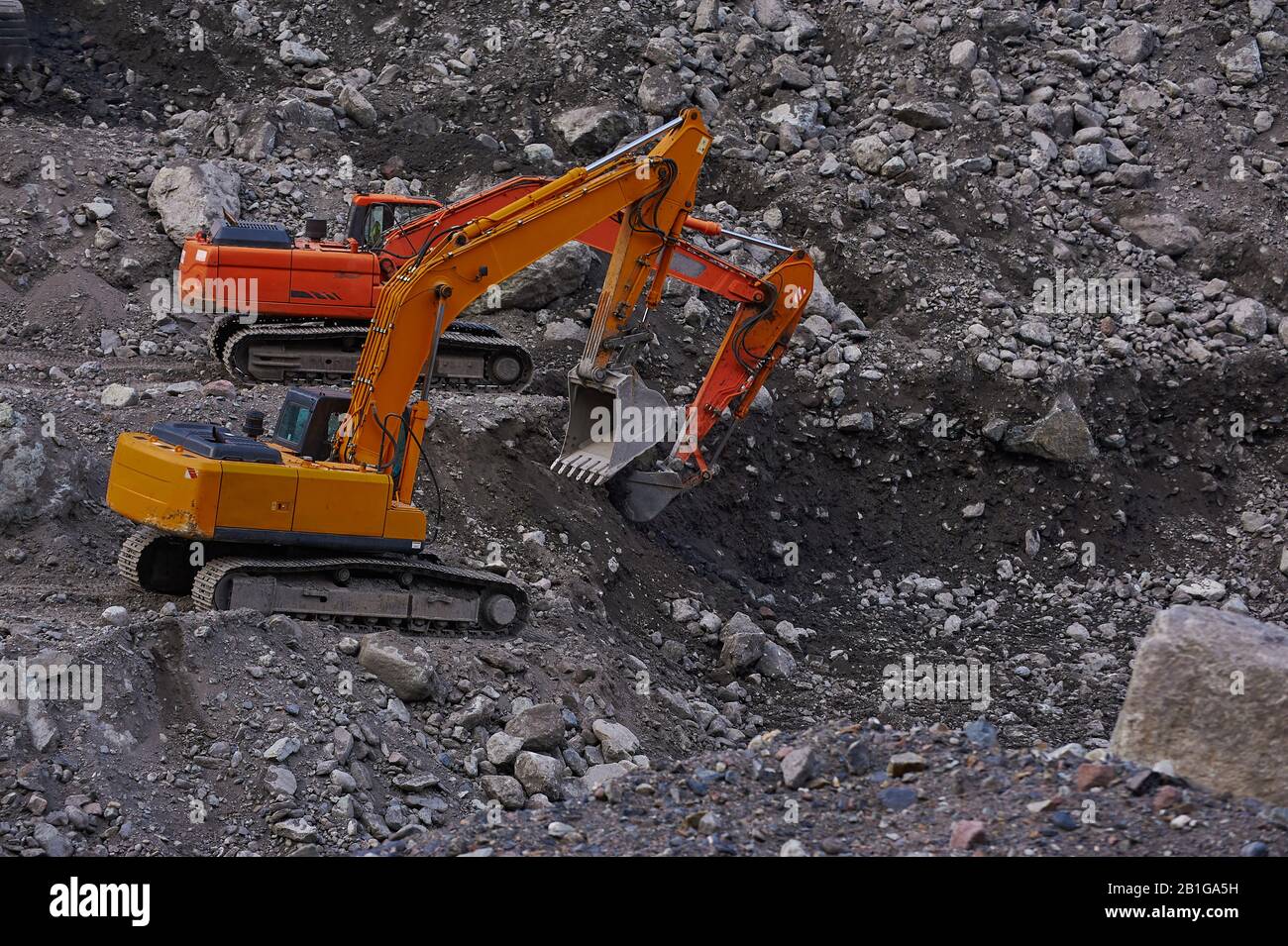 Two excavators digging ground together Stock Photo - Alamy Two excavators digging ground together Stock Photo - Alamy