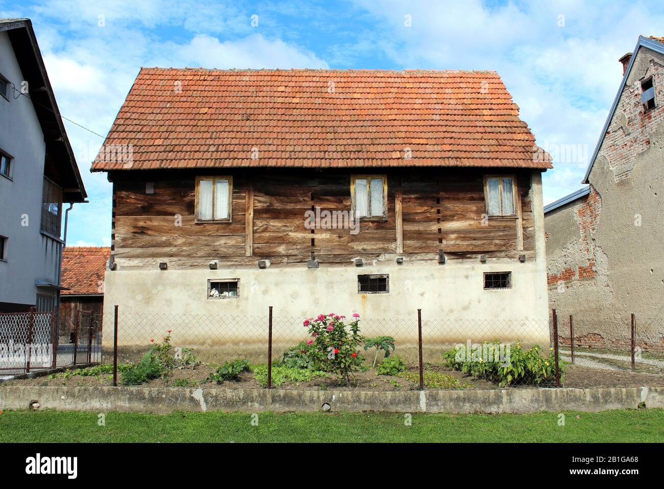 Vintage rustic retro old wooden suburban family house with tall ...