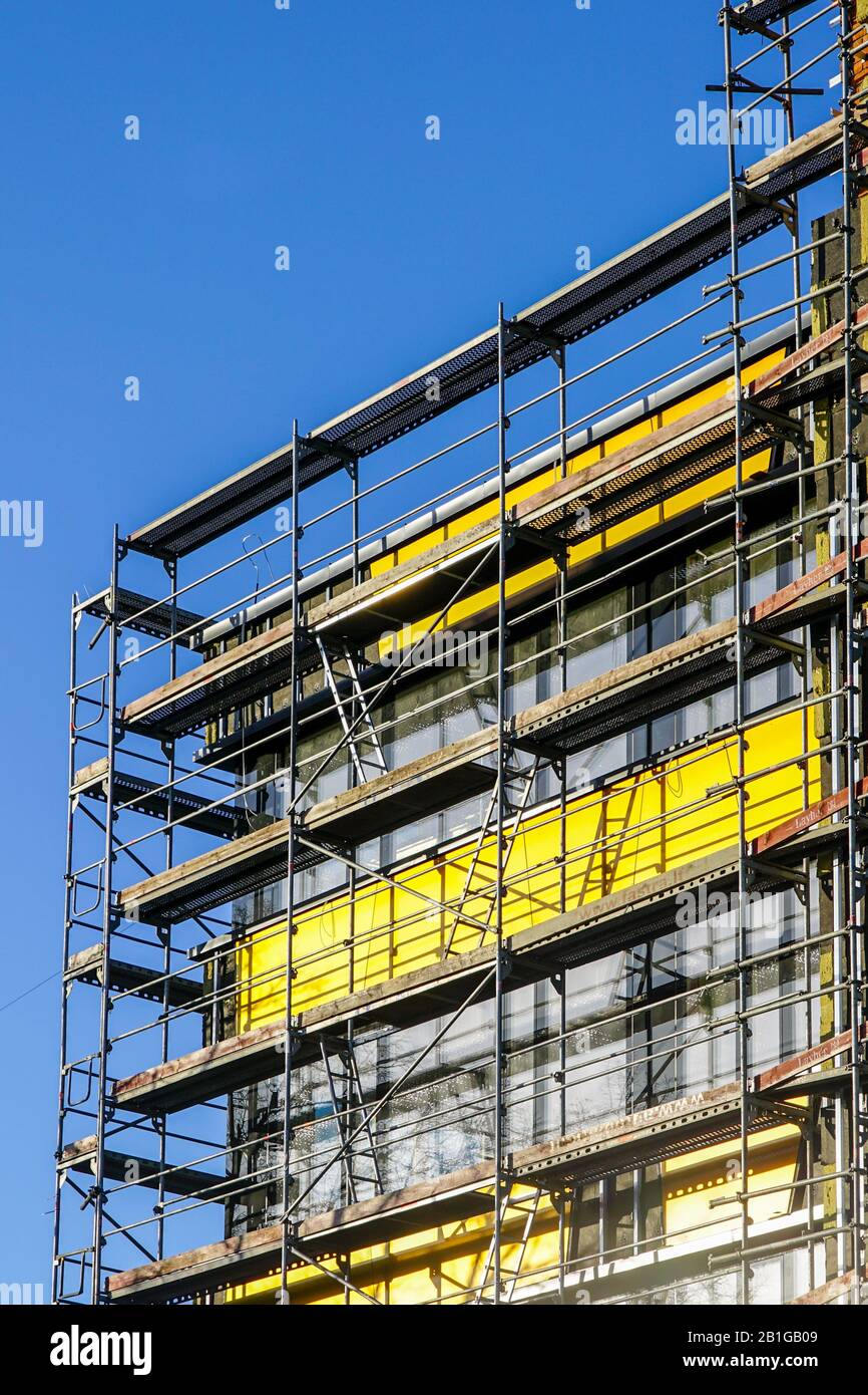 house facade renovation and thermal insulation, scaffolding Stock Photo ...