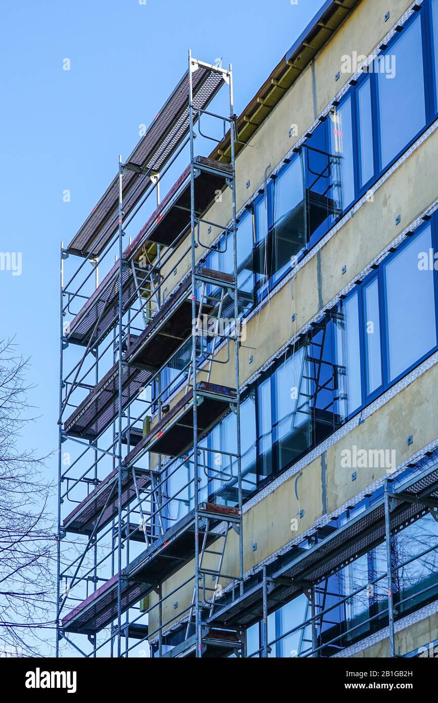 house facade renovation and thermal insulation, scaffolding Stock Photo ...