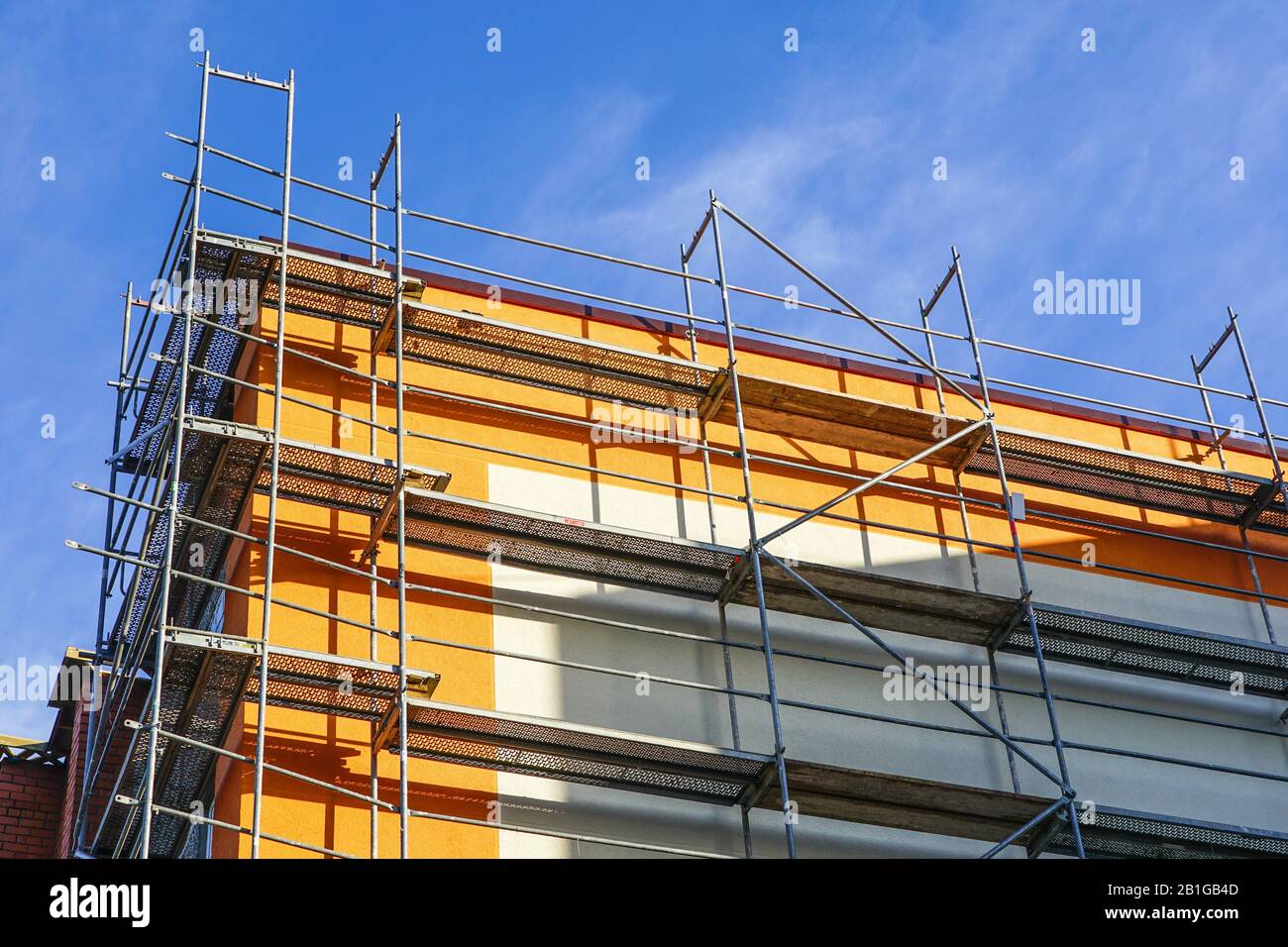 house facade renovation and thermal insulation, scaffolding Stock Photo ...
